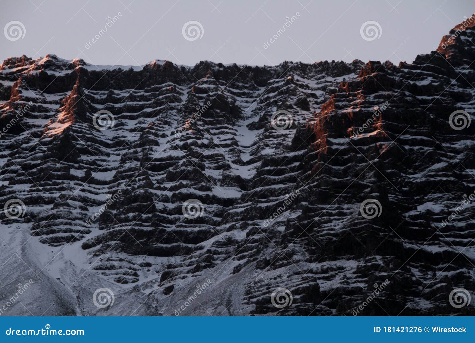 Beautiful View of the Weathered Rocks Covered in Snow in Iceland Stock ...