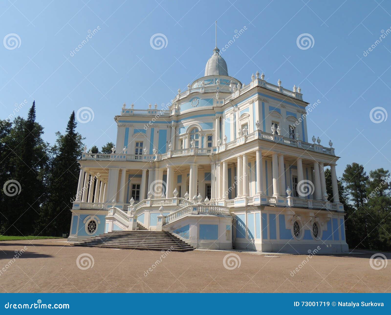 Beautiful Vintage Blue and White Building with Columns and Staircase ...