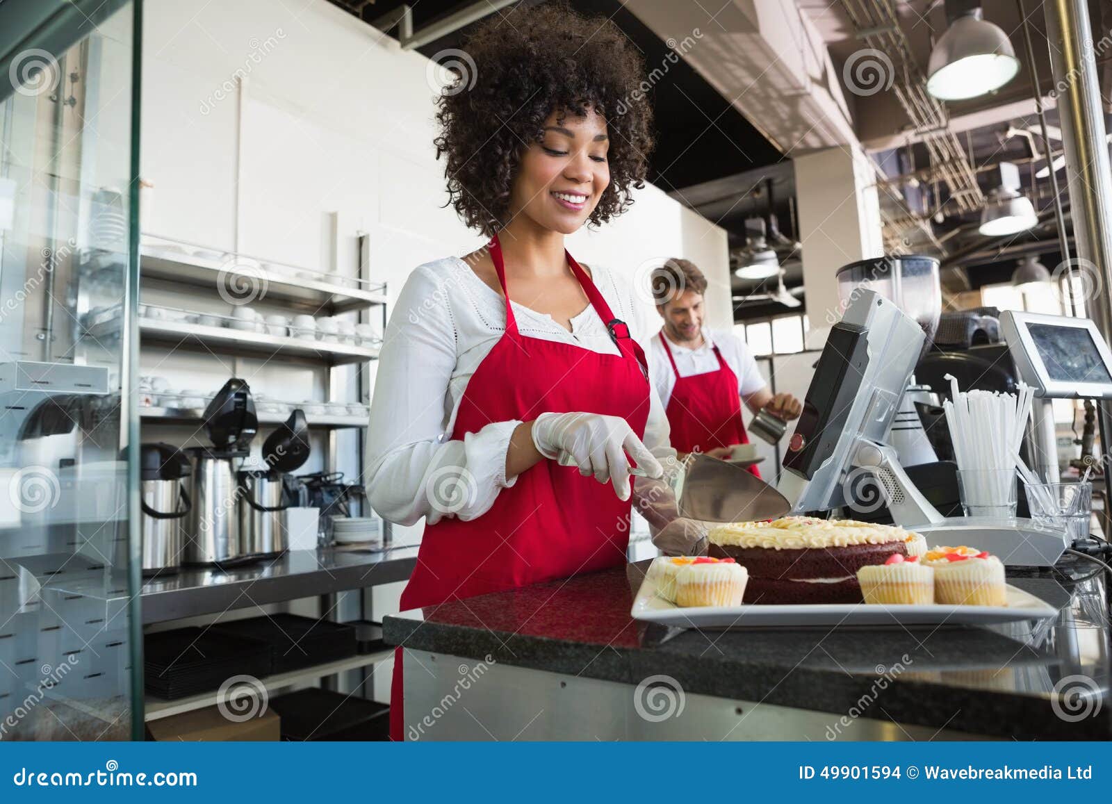 Beautiful Waitress in Red Apron Slicing Cake Stock Photo - Image of ...