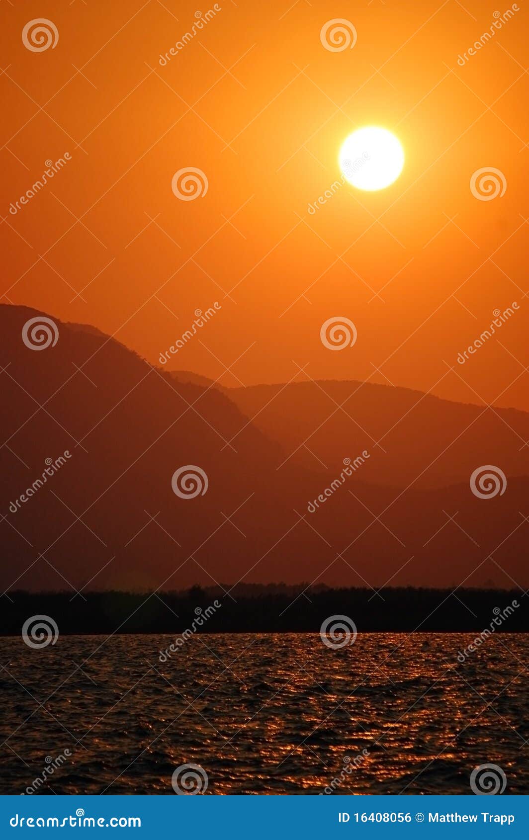 Beautiful Warm Sunset Over Mountains and Ocean Stock Photo - Image of ...