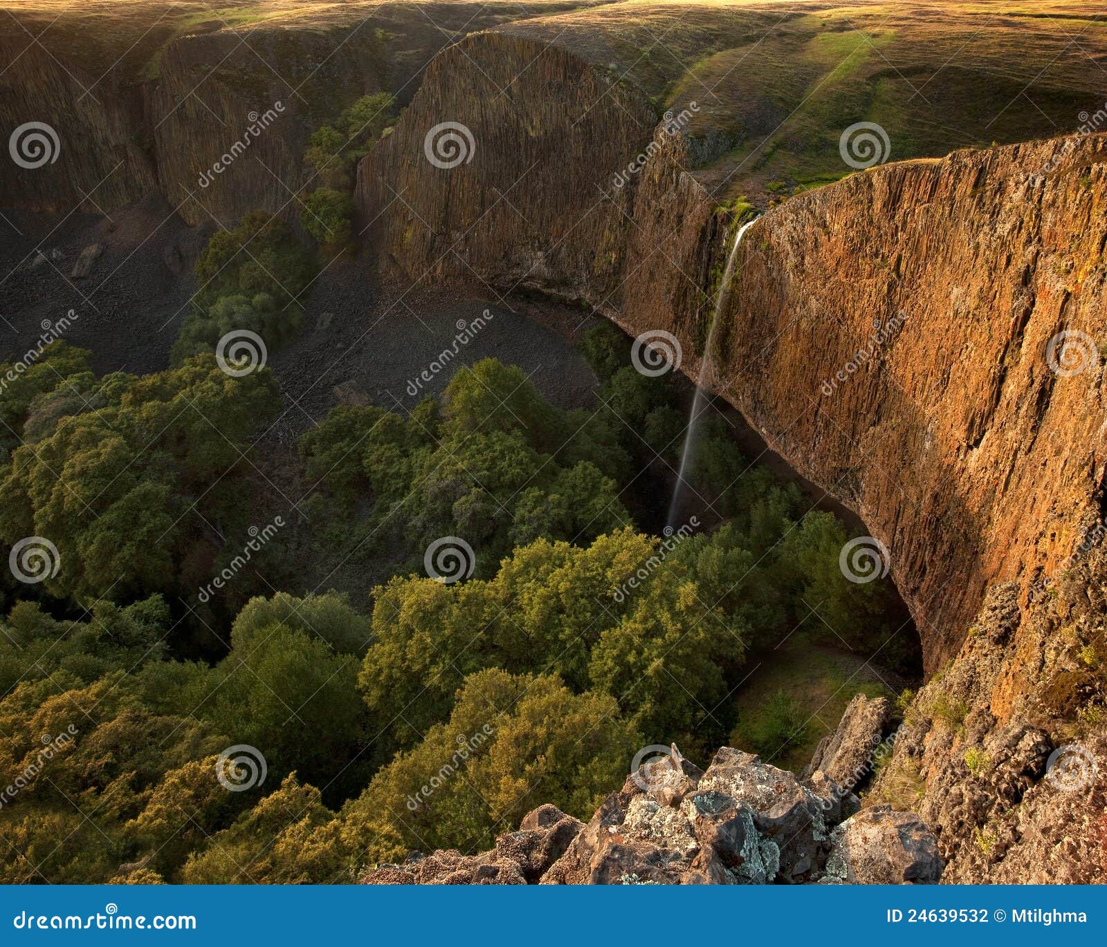 Beautiful Waterfall Over Cliff at Sunset Stock Photo - Image of ...