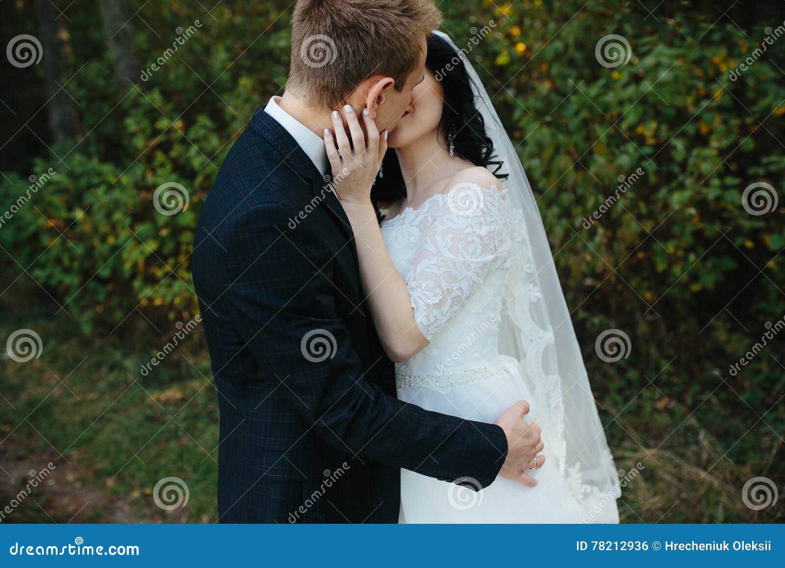 Beautiful Wedding Couple Kissing Stock Photo - Image of embrace ...