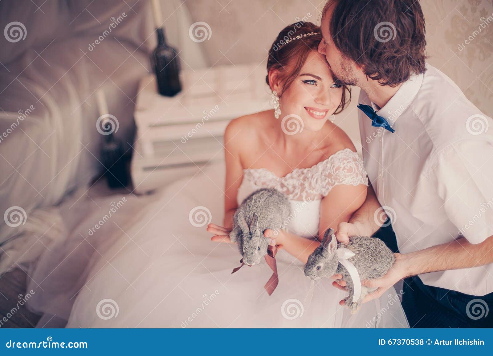 A Beautiful Wedding Couple with the Rabbits Stock Photo - Image of ...