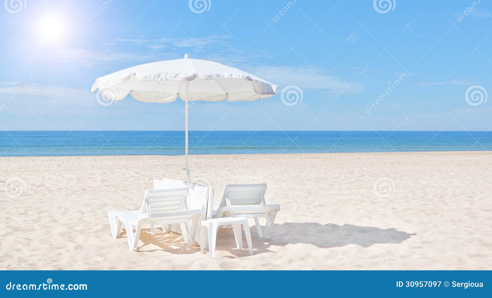 Beautiful White Beach Umbrella and Sun Bed on the Beach. Stock Image ...