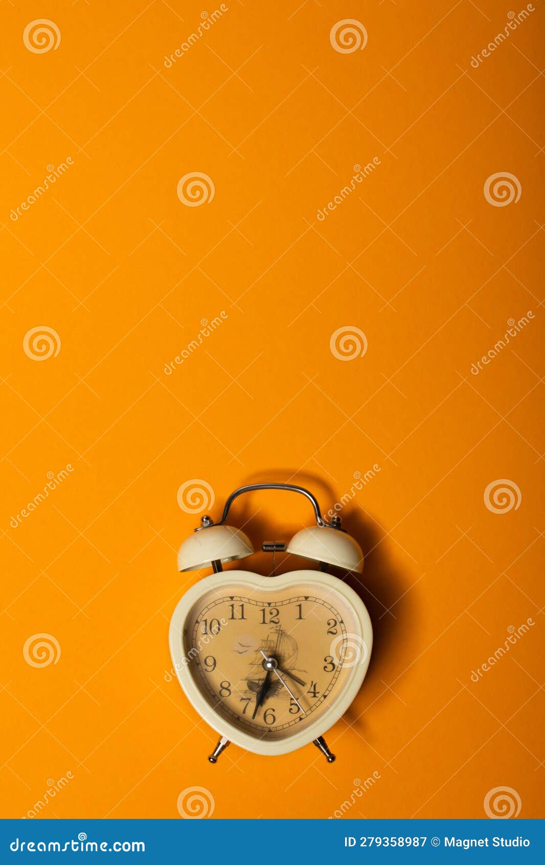 A Beautiful White Clock in the Shape of a Heart on a Yellow Background ...