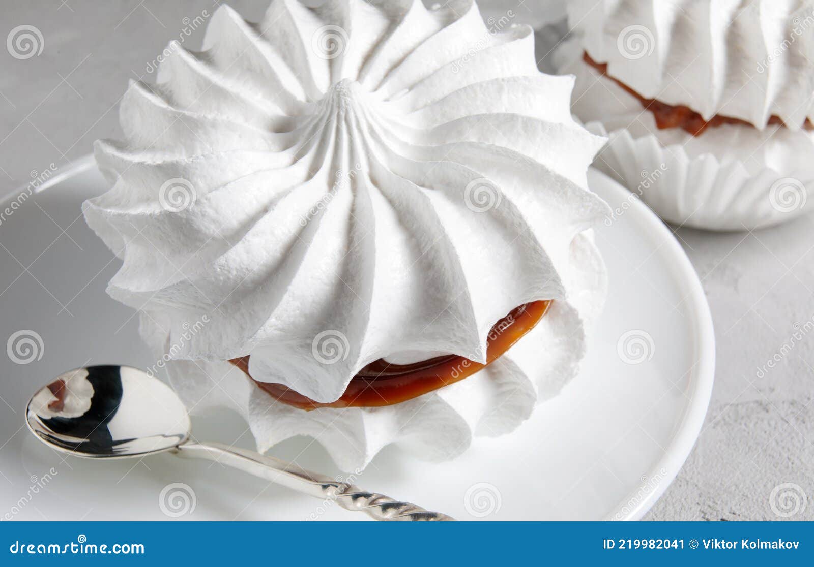 Beautiful White Meringues with a Silver Spoon on a White Plate. White ...