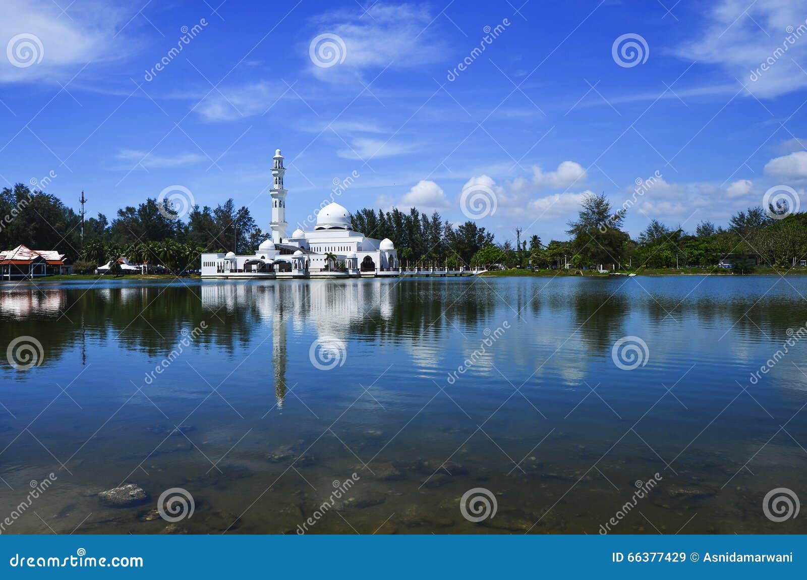 Beautiful White Mosque with Reflection in the Lake during Clean Blue ...