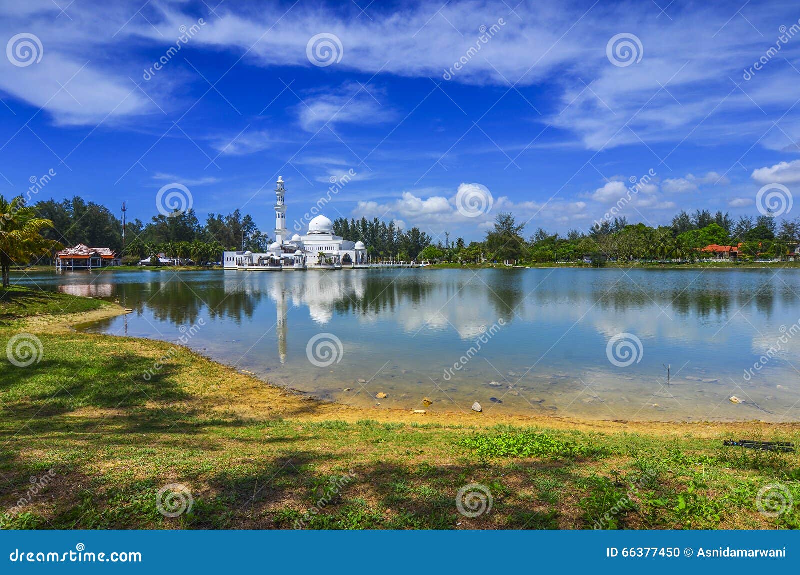 Beautiful White Mosque with Reflection in the Lake during Clean Blue ...
