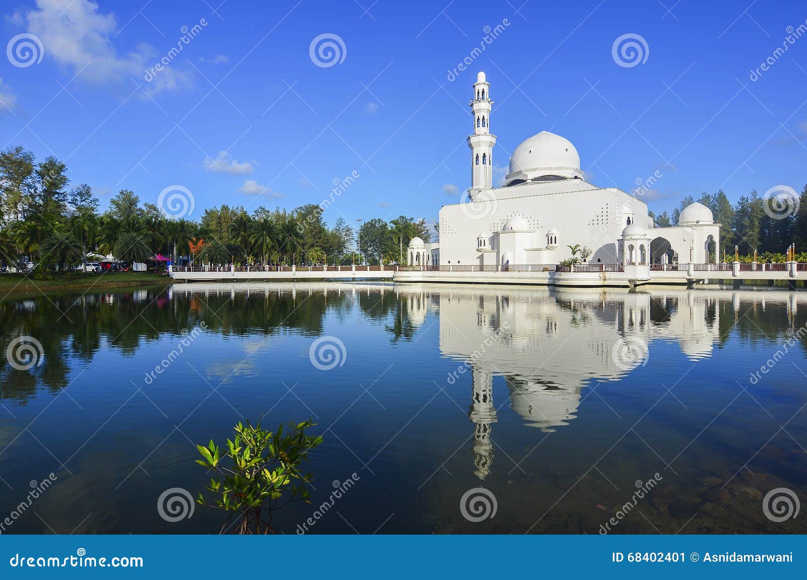 Beautiful White Mosque with Reflection in the Lake during Clean Blue ...