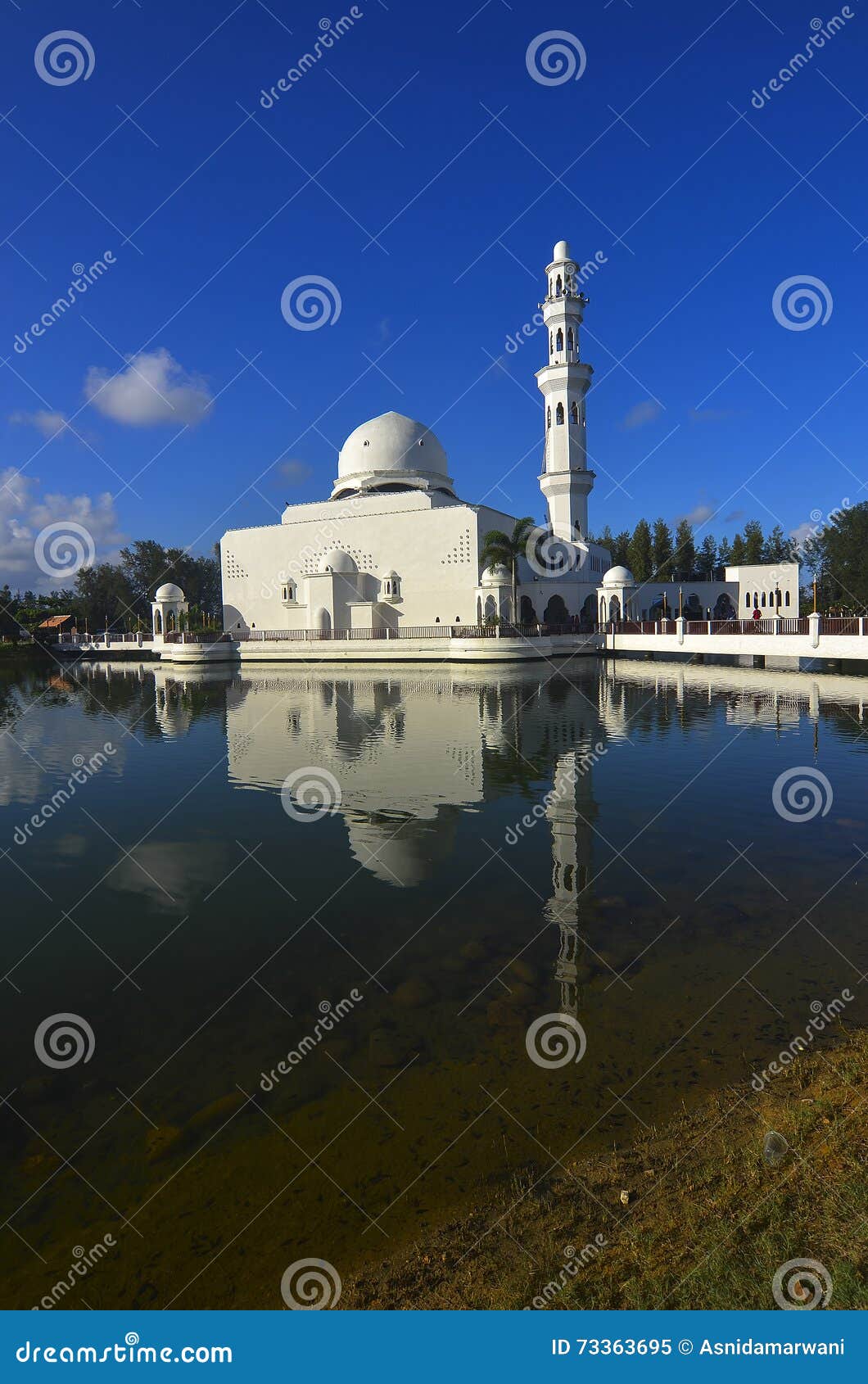 Beautiful White Mosque with Reflection in the Lake during Clean Blue ...