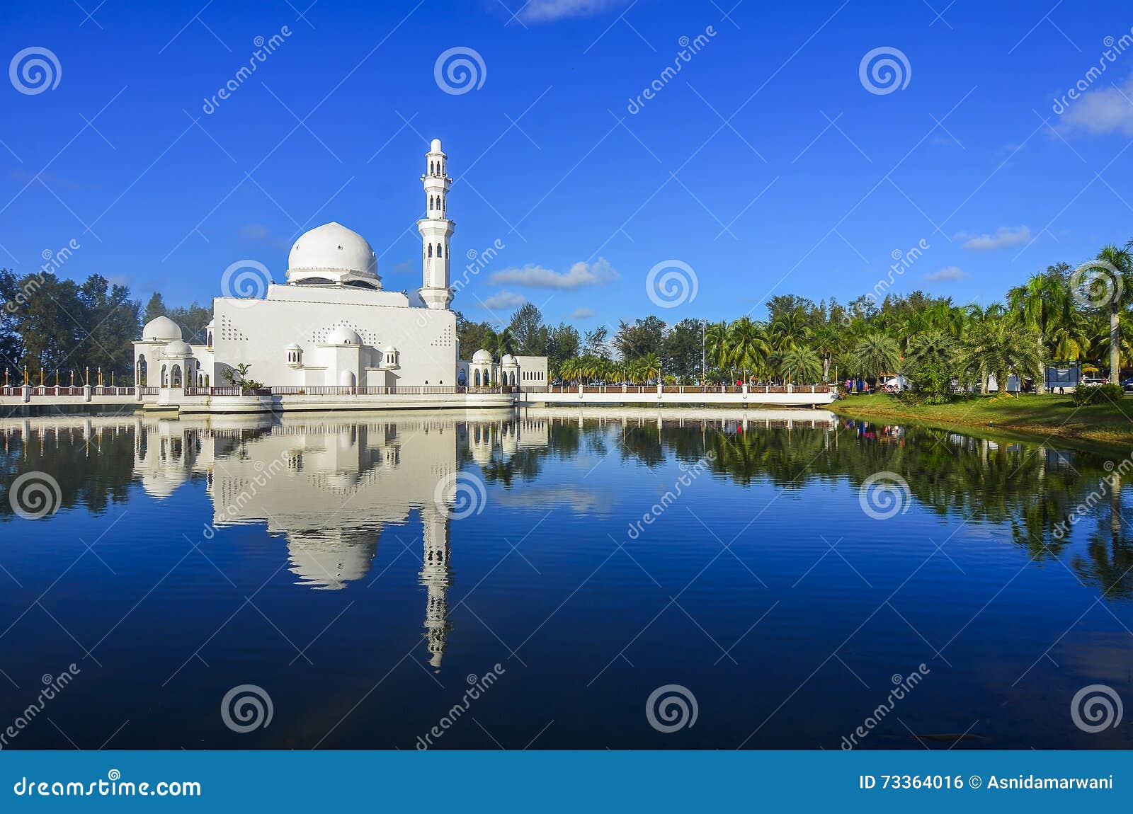 Beautiful White Mosque with Reflection in the Lake during Clean Blue ...