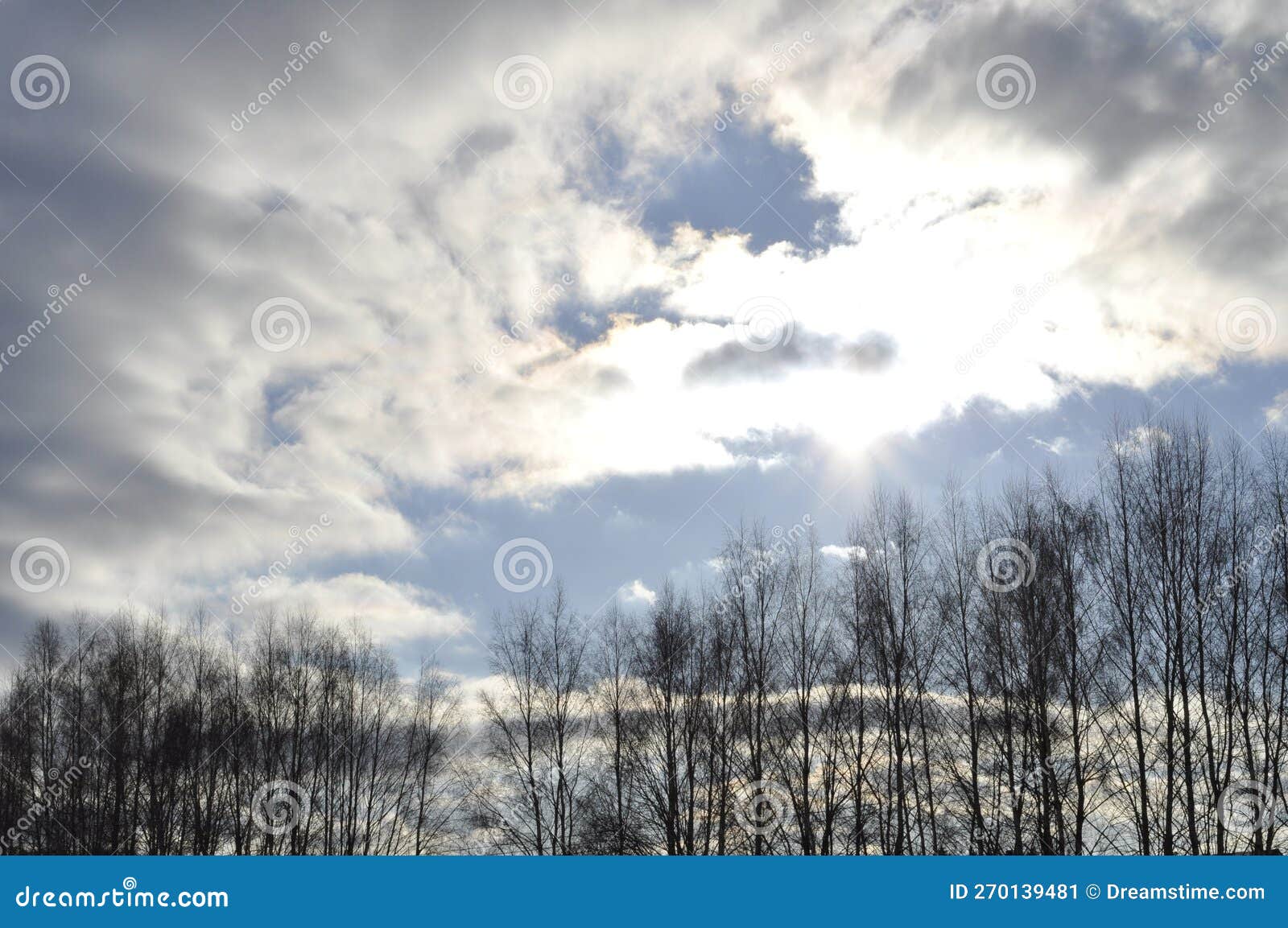 Beautiful Winter Sky with White Clouds and Sun Shining from the Clouds ...