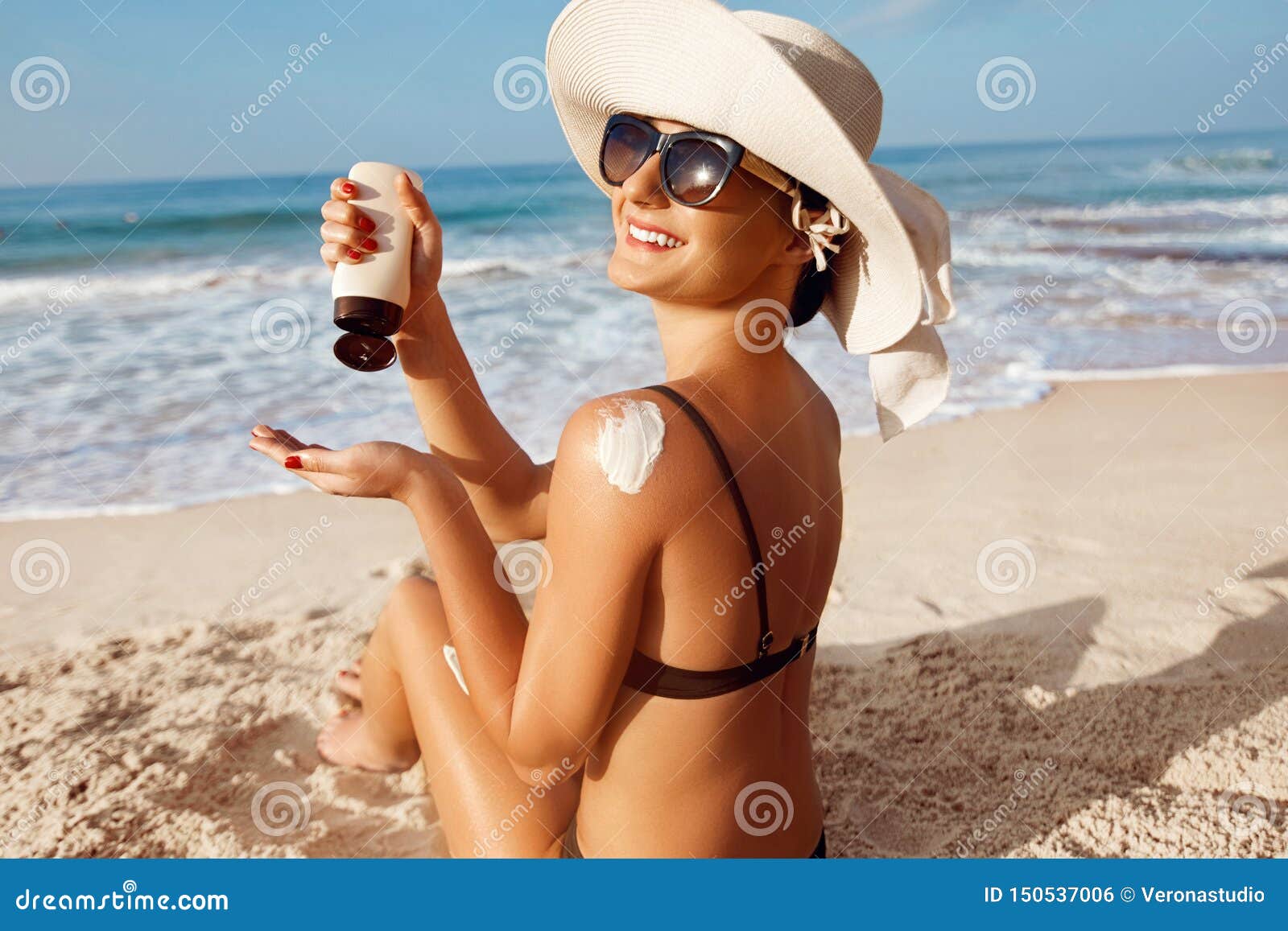 Beautiful Woman Apply Sun Cream On Tanned Back Skin And Body Care Sun