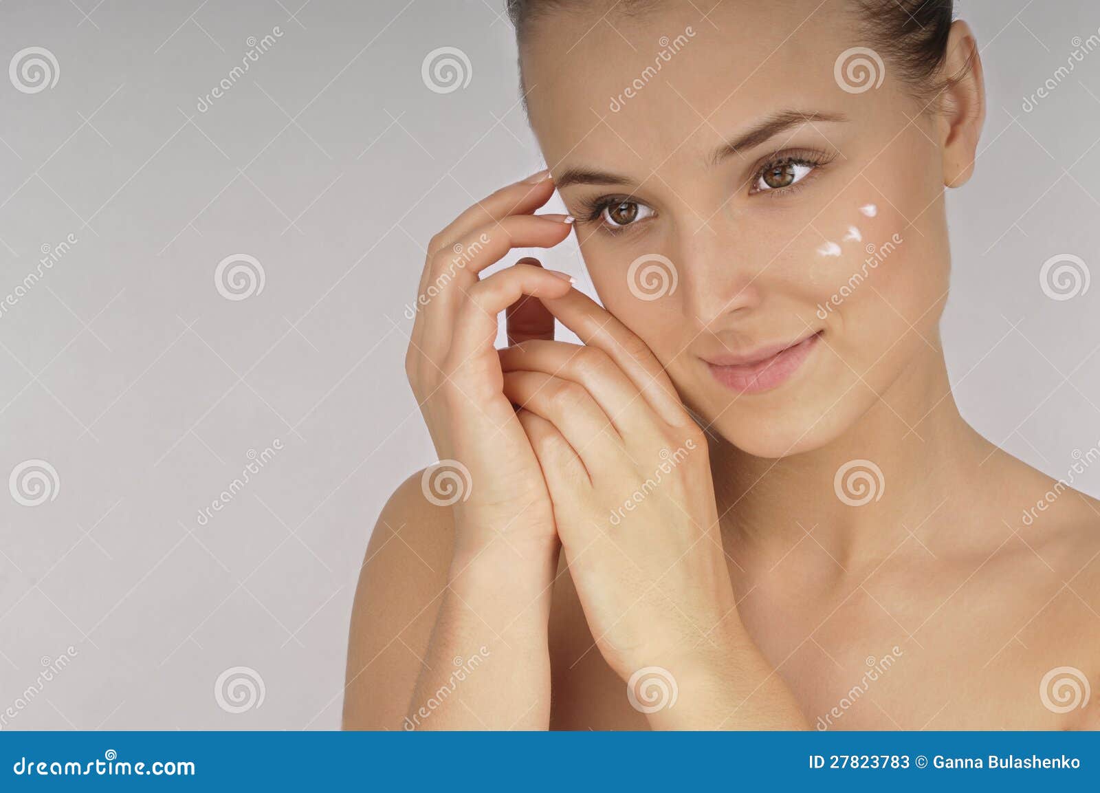 Beautiful Woman Applying Cream on Face. Stock Image - Image of ...