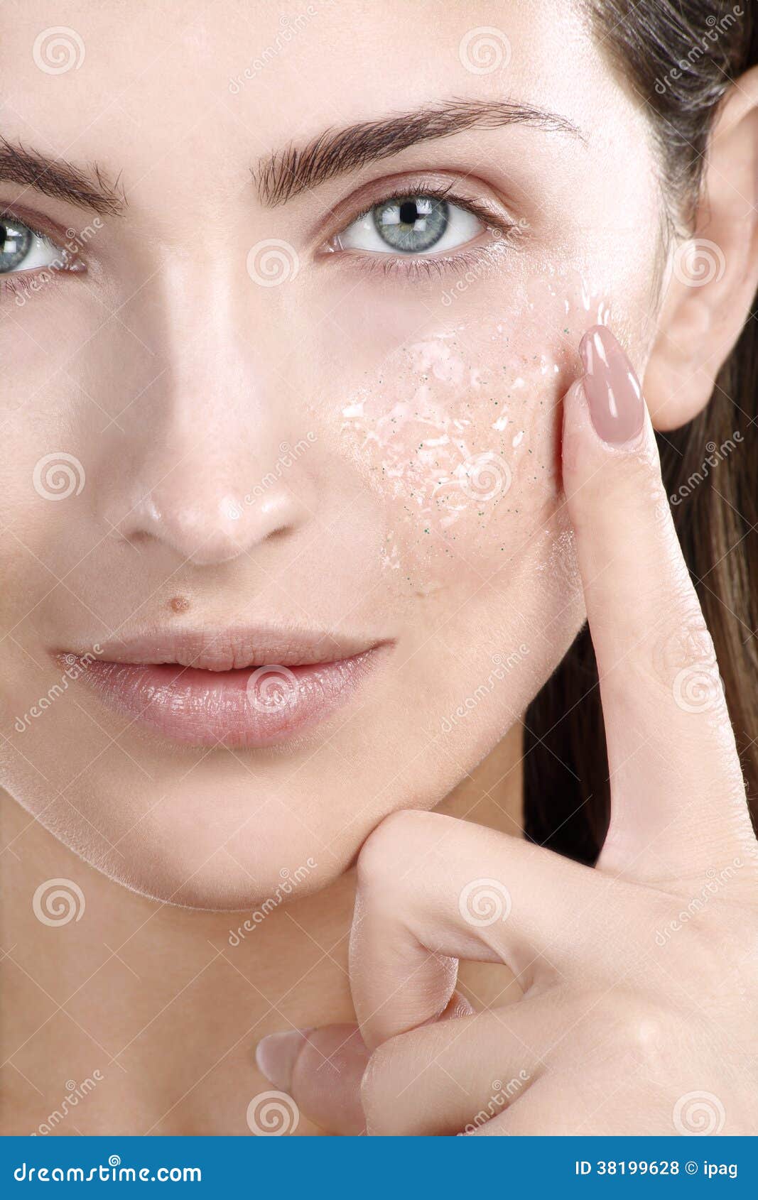 Beautiful Woman Applying Scrub Treatment on Face Stock Photo - Image of ...