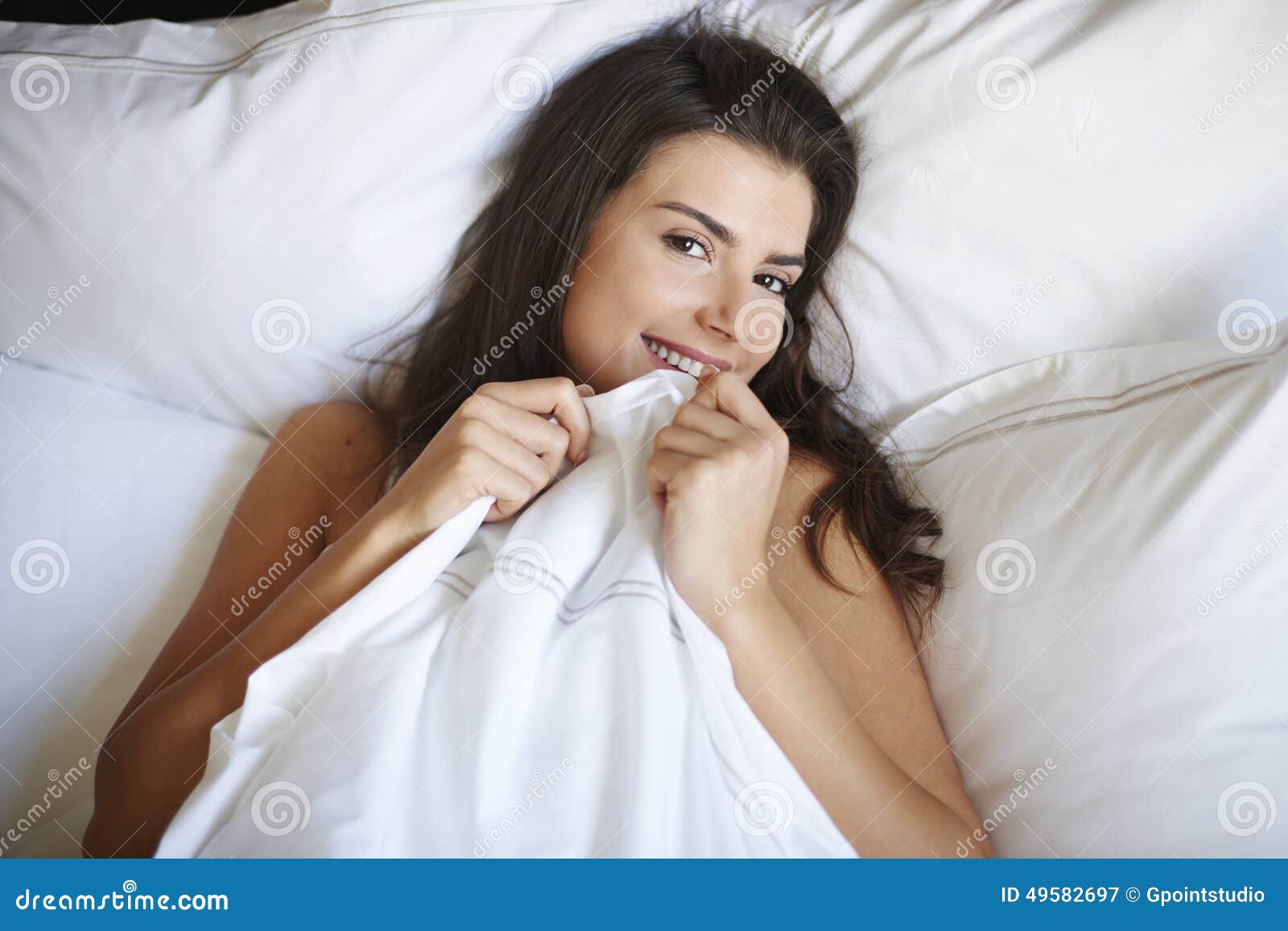 Beautiful woman in bed stock image. Image of covering - 49582697