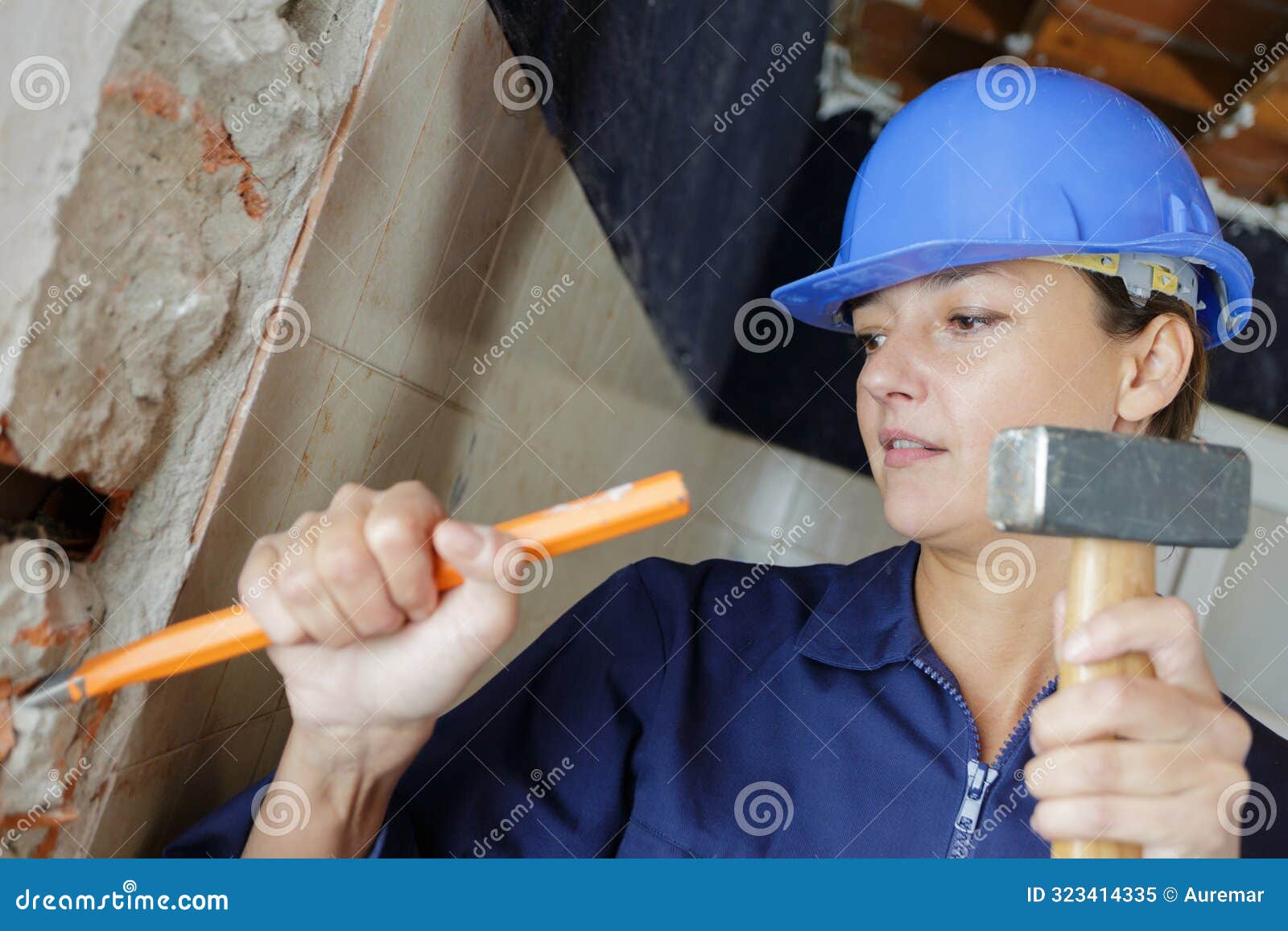 Beautiful Woman Breaking Wall Stock Image - Image of beauty, worker ...