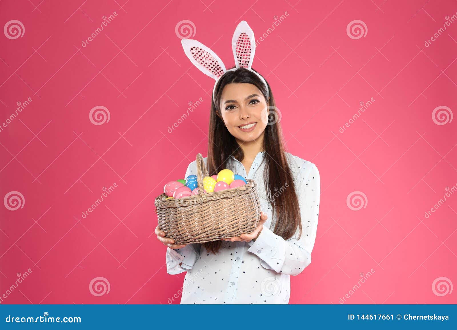 Beautiful Woman In Bunny Ears Headband Holding Basket With Easter Eggs