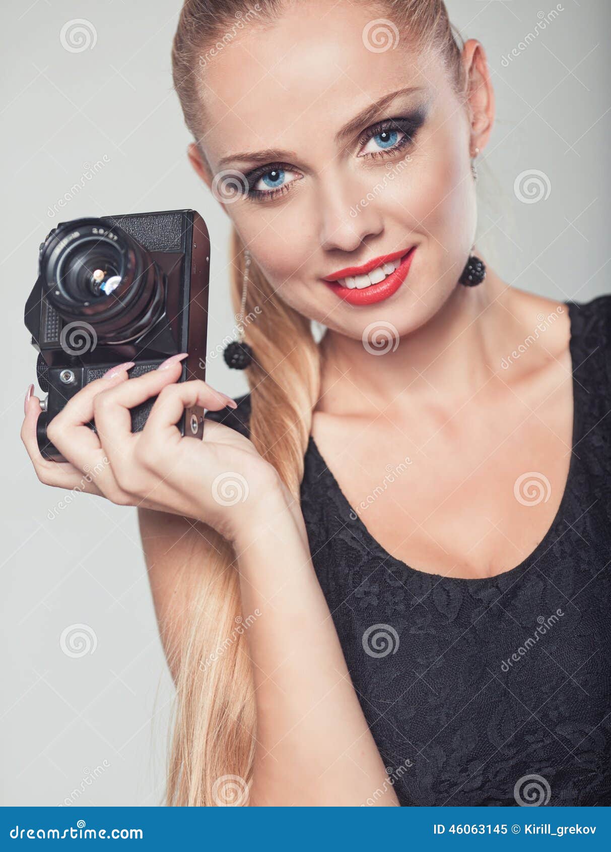 Beautiful Woman with Camera Stock Image - Image of fashion, hair: 46063145