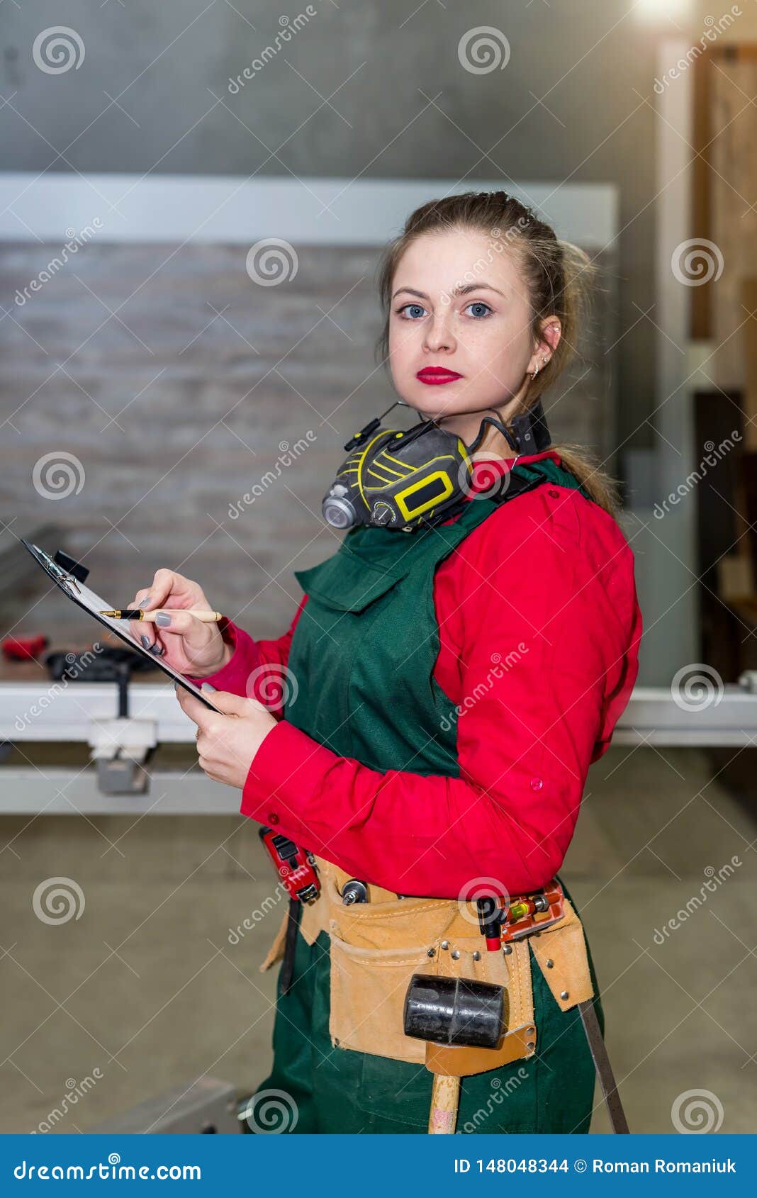 Beautiful Woman Carpenter Making Some Notes on Paper Stock Photo ...