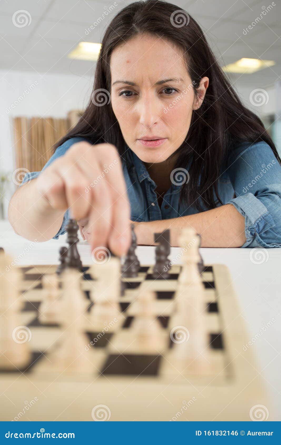 Beautiful woman and chess stock photo. Image of competition - 161832146