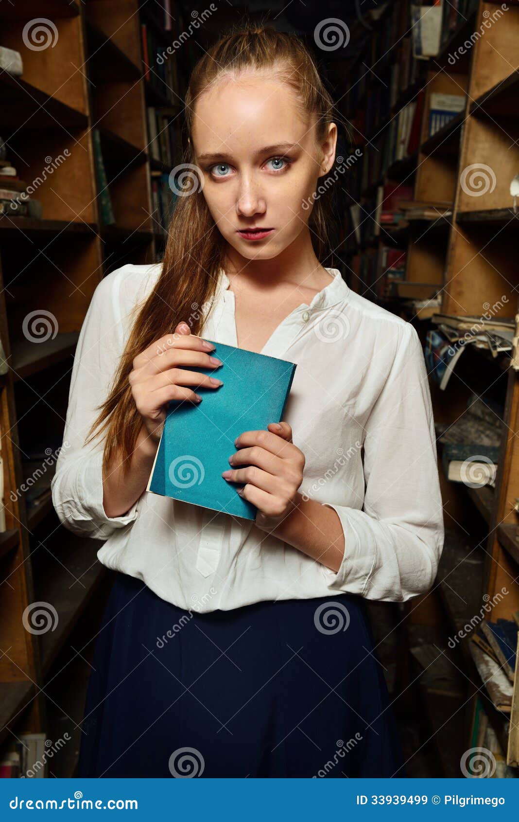 Beautiful Woman Choosing the Book in Library. Stock Image - Image of ...