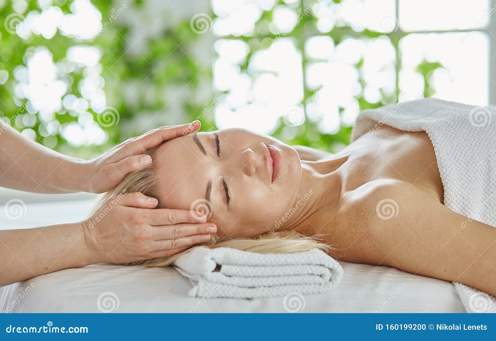Beautiful Woman With Closed Eyes Getting A Massage In The Spa Salon