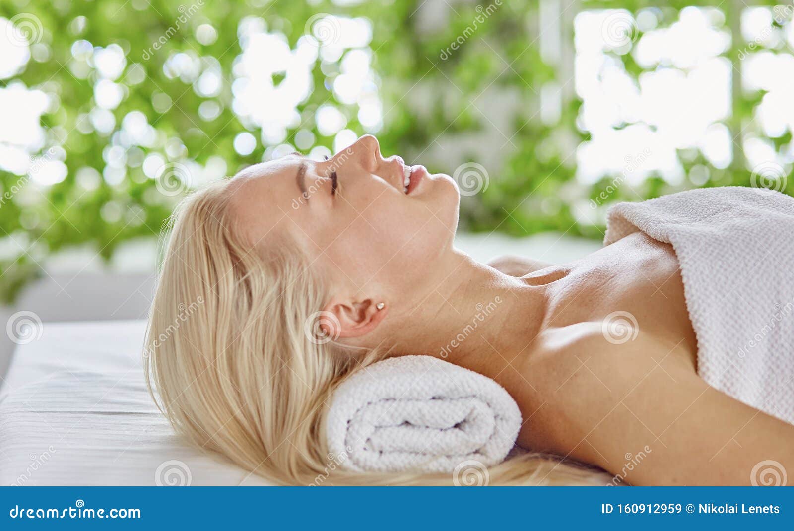 Beautiful Woman With Closed Eyes Getting A Massage In The Spa S Stock