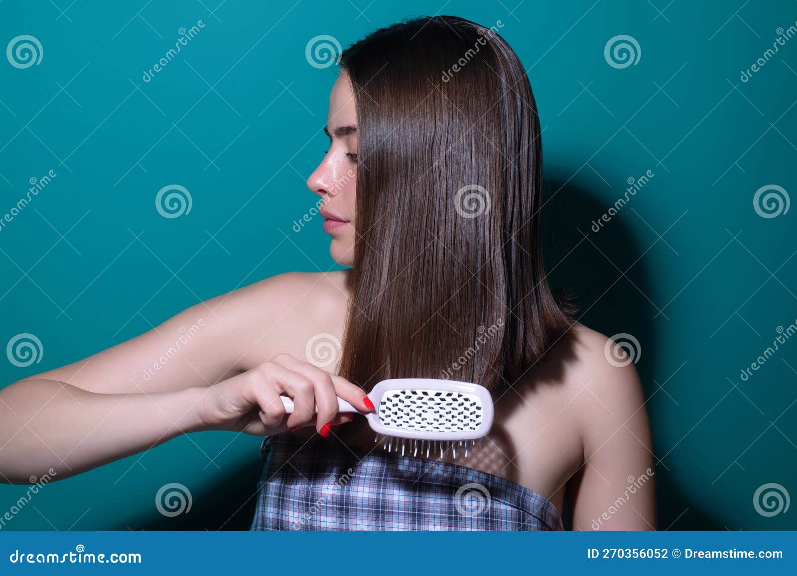 Beautiful Woman Combing Her Hair in Studio. Stock Photo - Image of ...