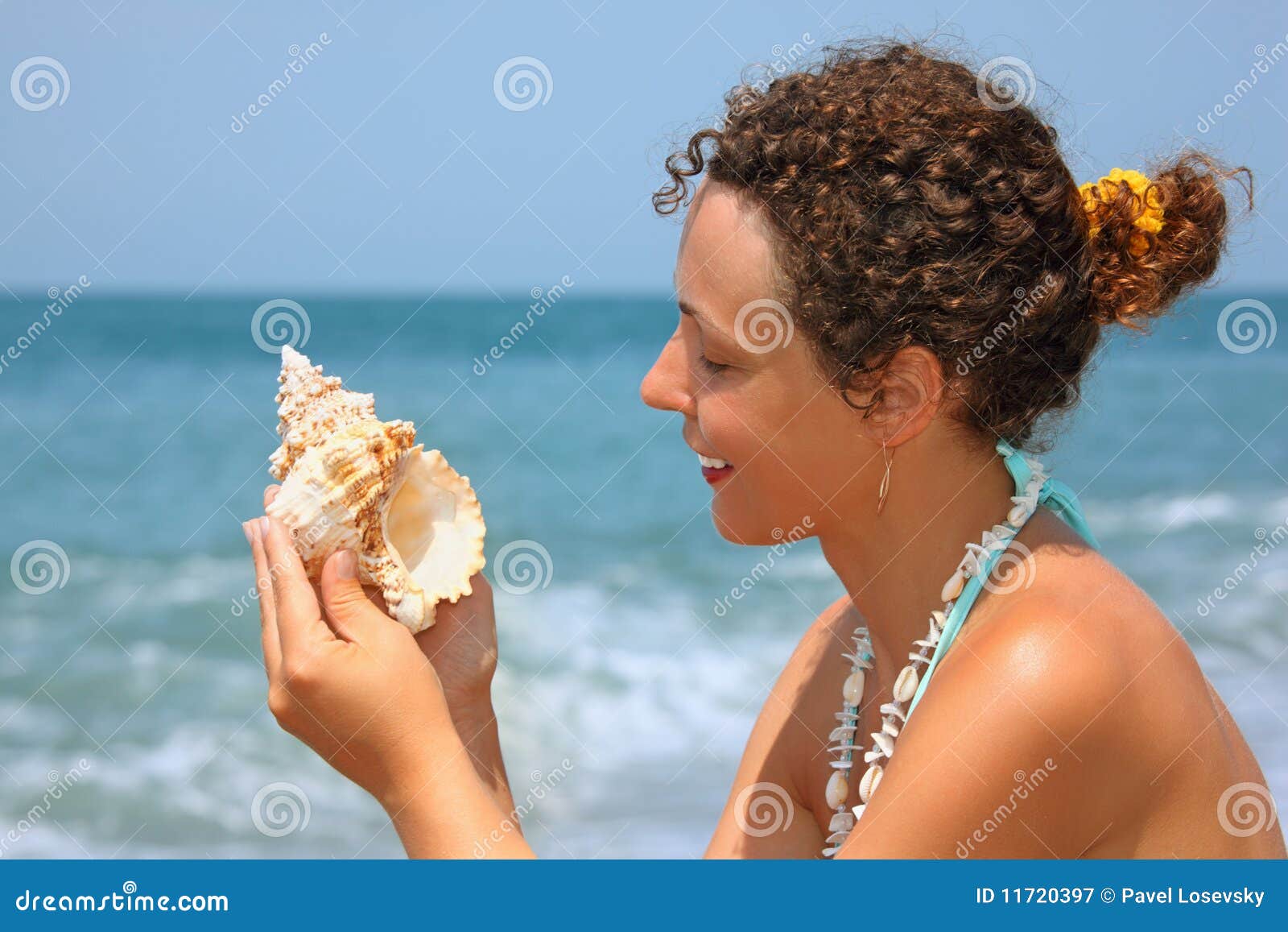 Beautiful Woman Considering Seashell on Seacoast Stock Image - Image of ...