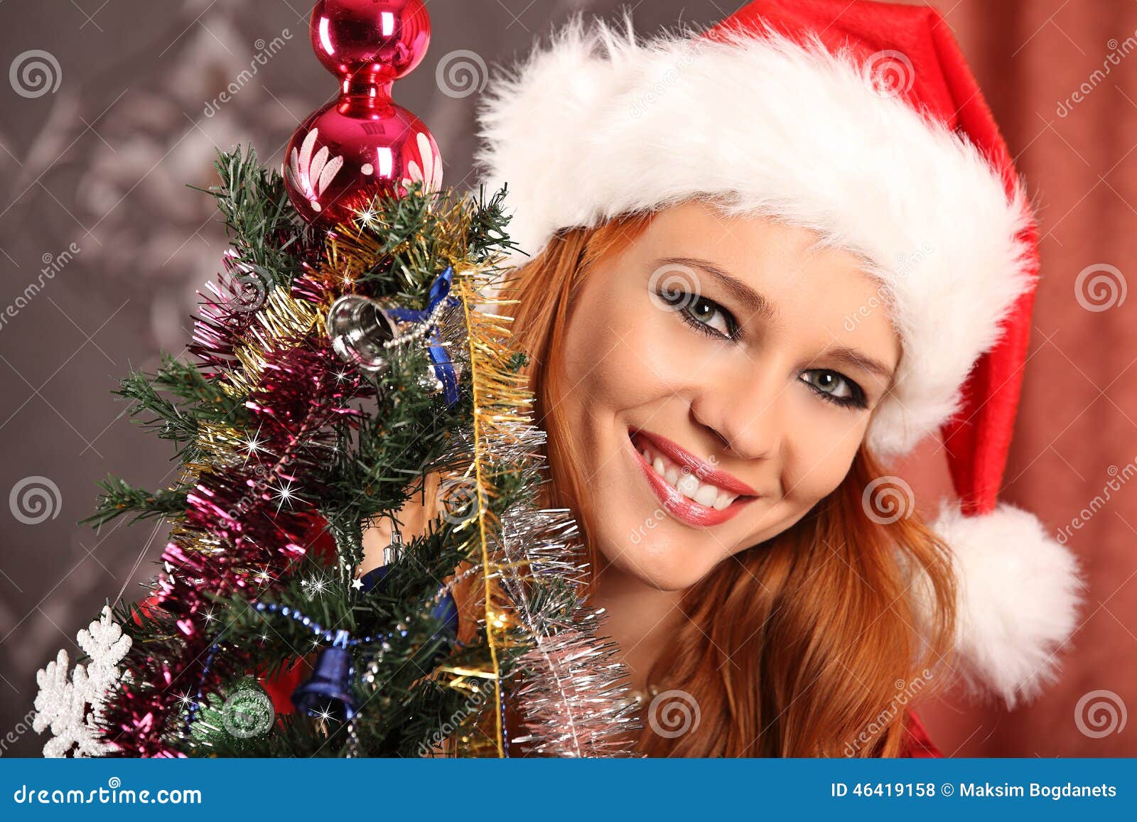 Beautiful Woman Decorating the Christmas Tree Stock Photo - Image of ...