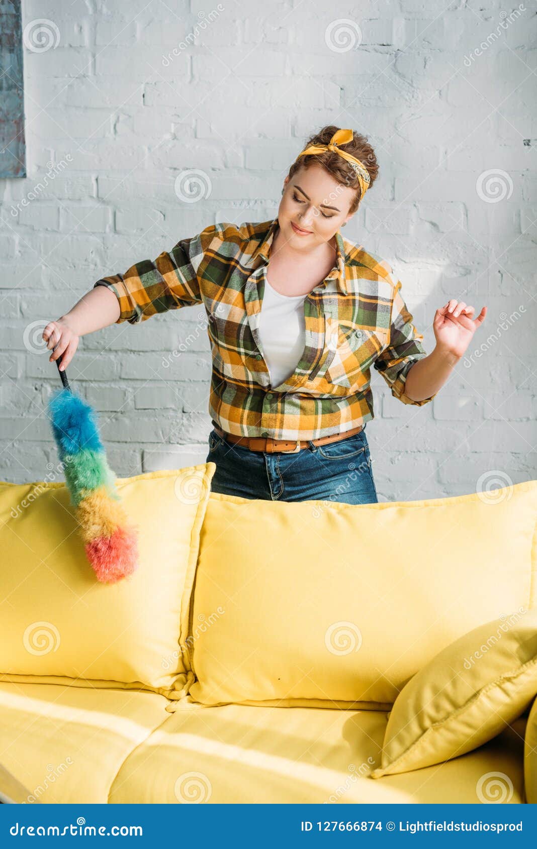 Beautiful Woman Dusting Yellow Sofa Stock Photo - Image of tools ...