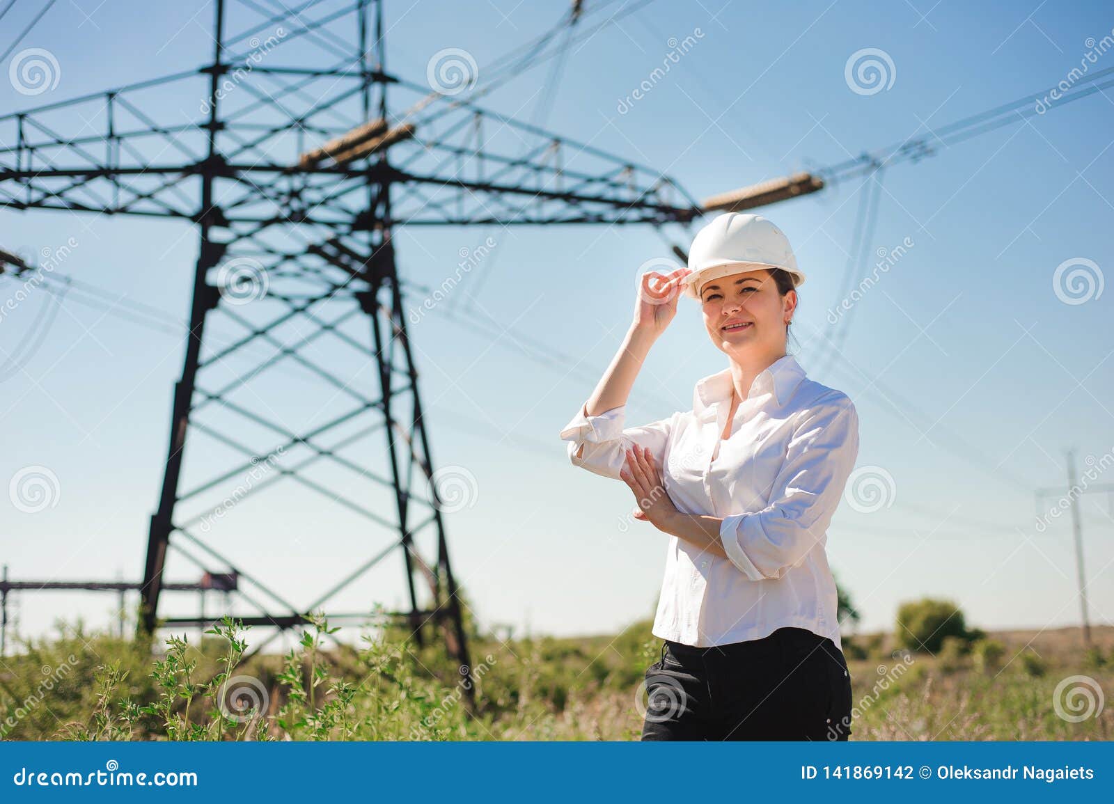 Beautiful Woman Engineer Work at an Electrical Substation. Stock Photo ...