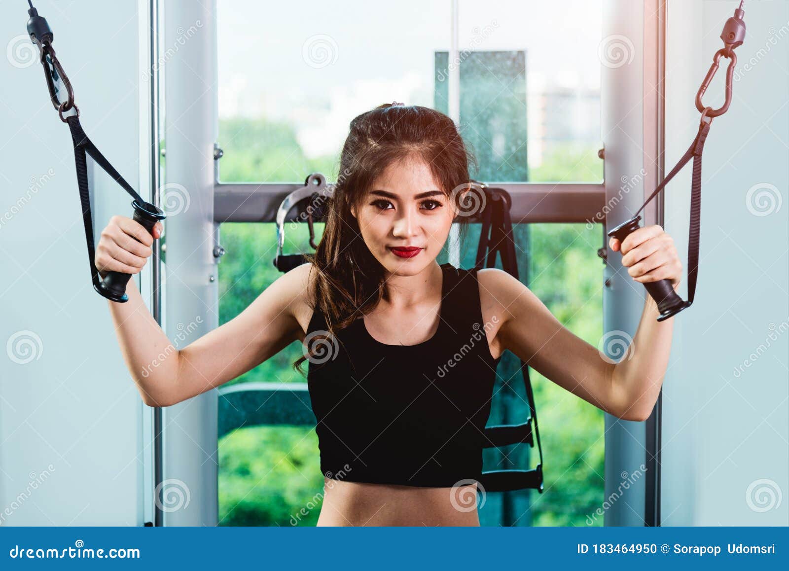 Beautiful Woman Exercise Using Machine Crossover Cable Training Workout ...