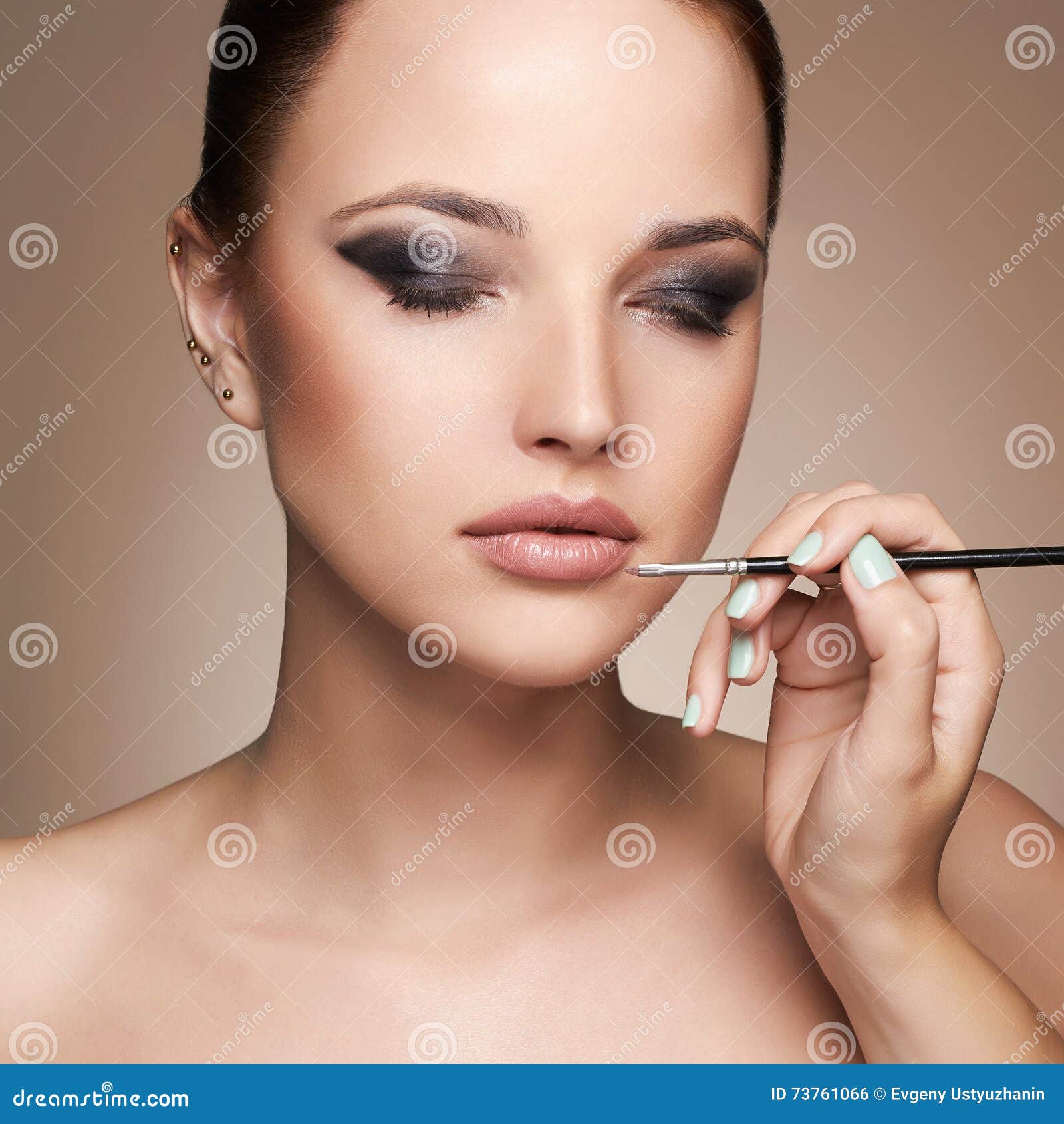 Beautiful Woman Face Beauty Girl With Make Up Applies Lipstick Stock