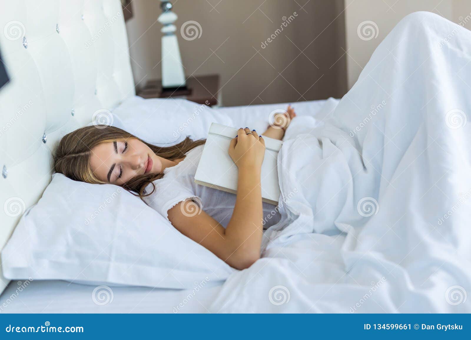 Beautiful Young Woman Falling Asleep while Reading a Book Stock Image ...
