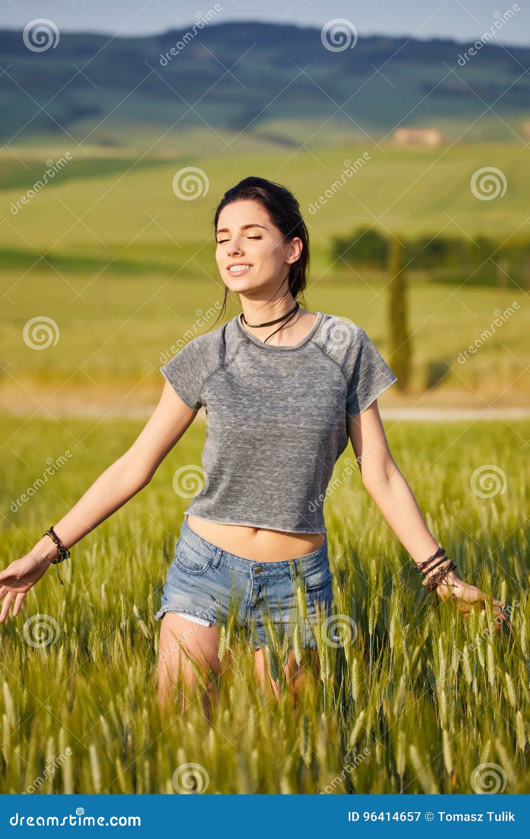 Beautiful woman in a field stock image. Image of flare - 96414657
