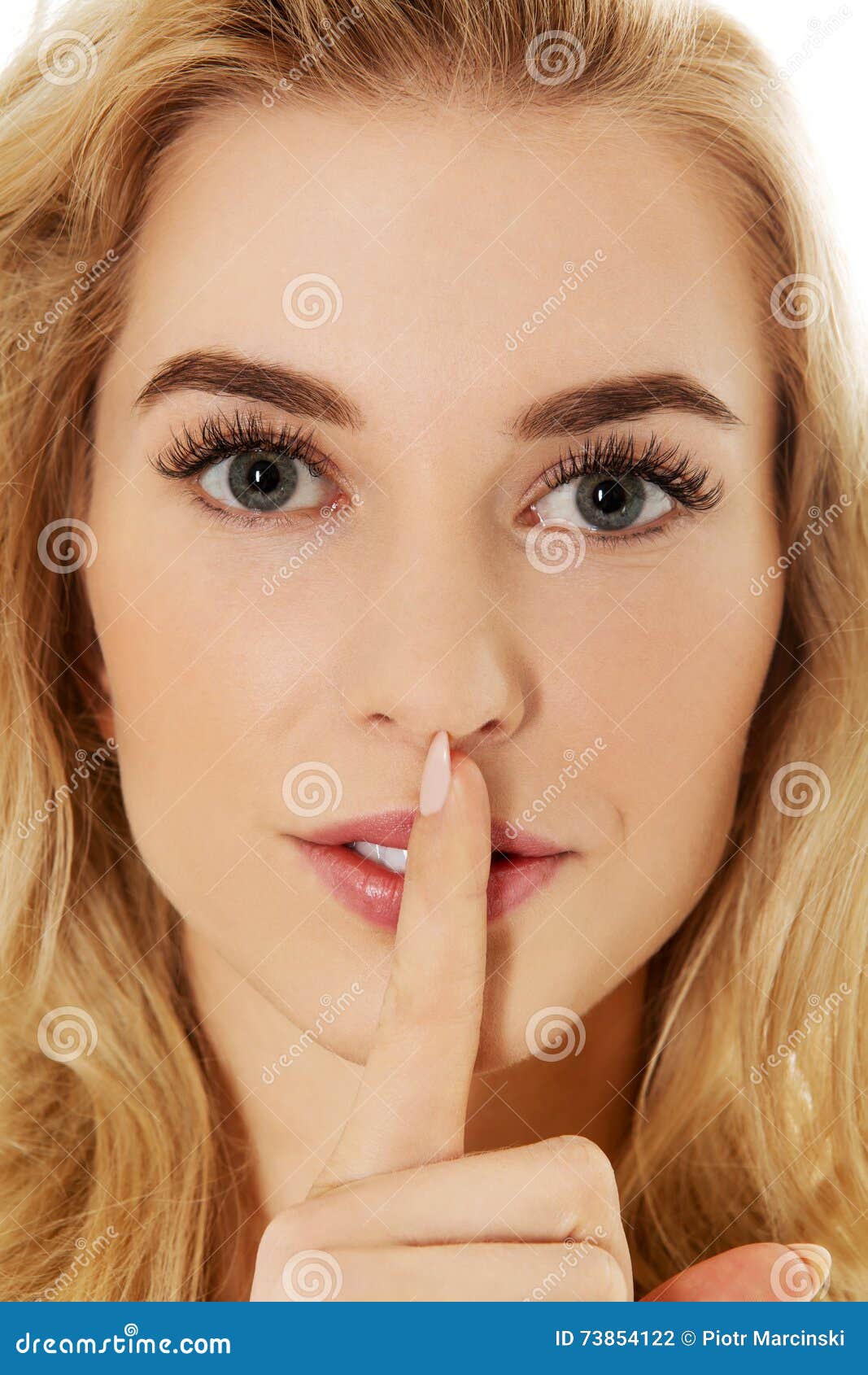 Beautiful Woman with Finger on Lips Stock Photo - Image of blonde ...