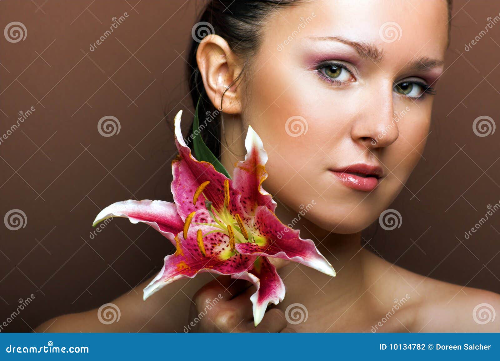 Beautiful Woman with a Flower Stock Photo - Image of cosmetic, lily ...