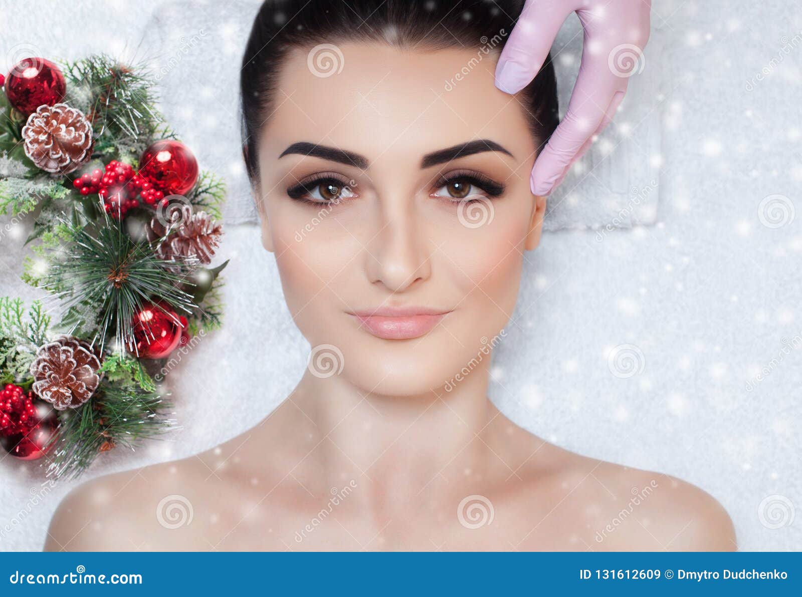A Beautiful Woman Gets A Facial Massage In The Spa Salon Closeup Of