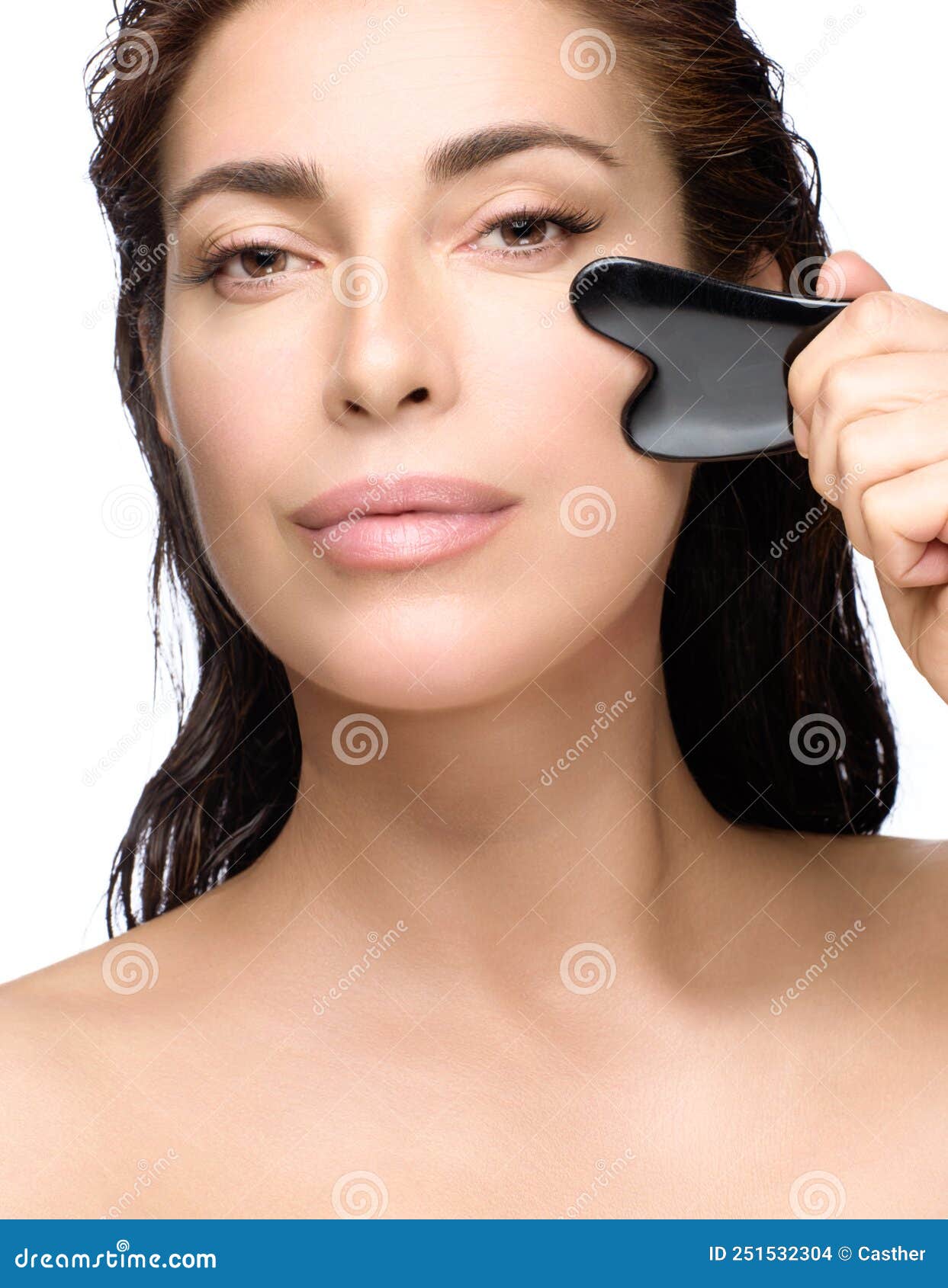 Beautiful Woman With Glowing Healthy Skin Massaging Face With Gua Sha