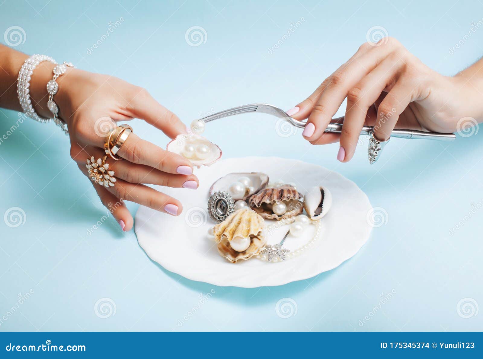 Beautiful Woman Hands With Pink Manicure Holding Plate With Pearls And