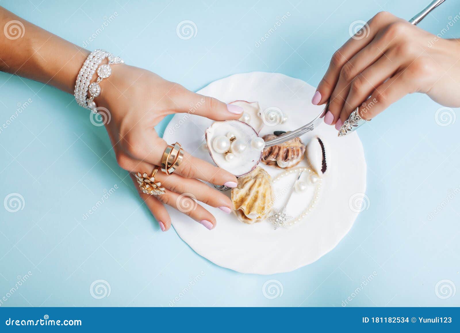 Beautiful Woman Hands With Pink Manicure Holding Plate With Pearls And