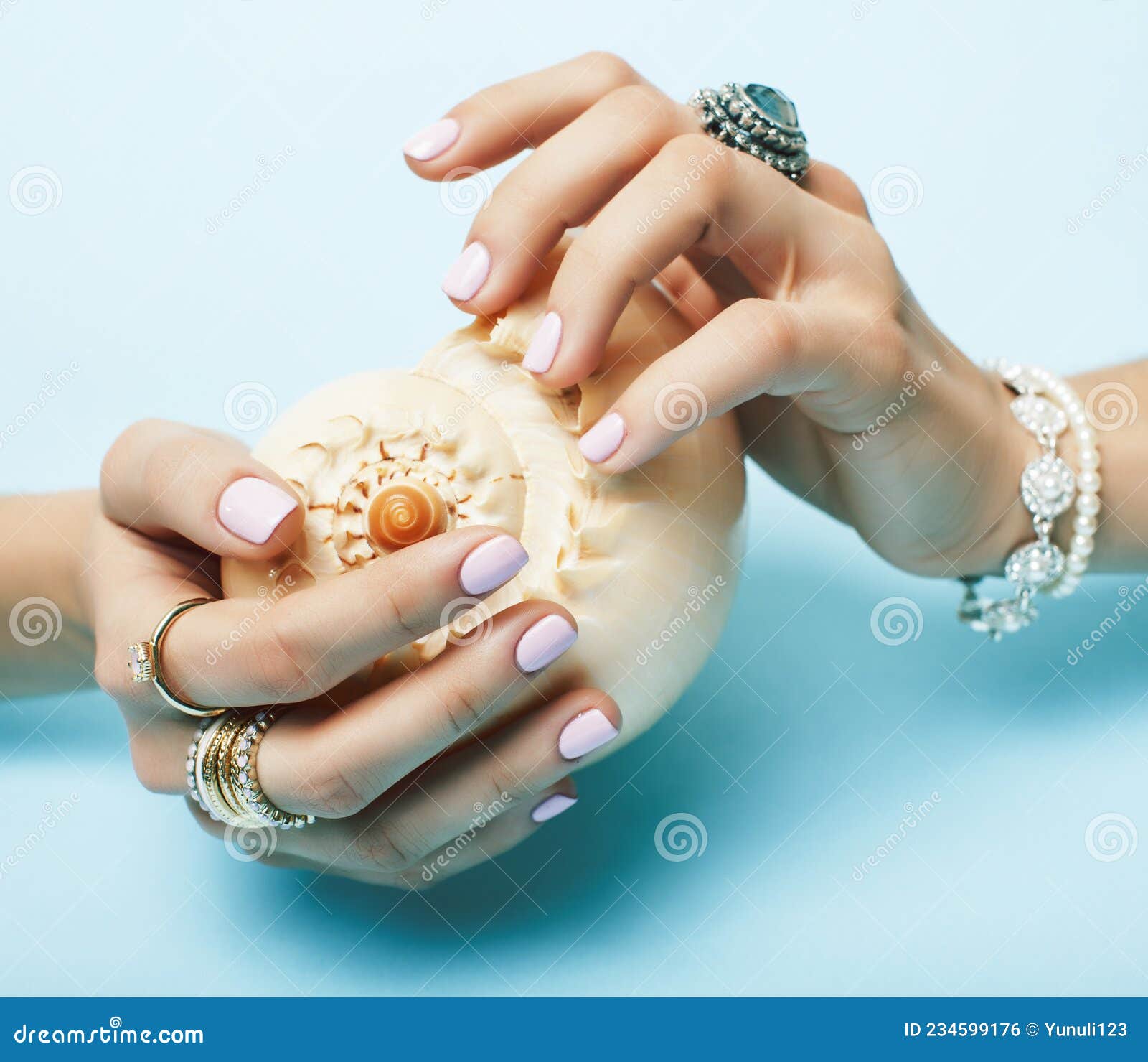 Beautiful Woman Hands With Pink Manicure Holding Plate With Pearls And