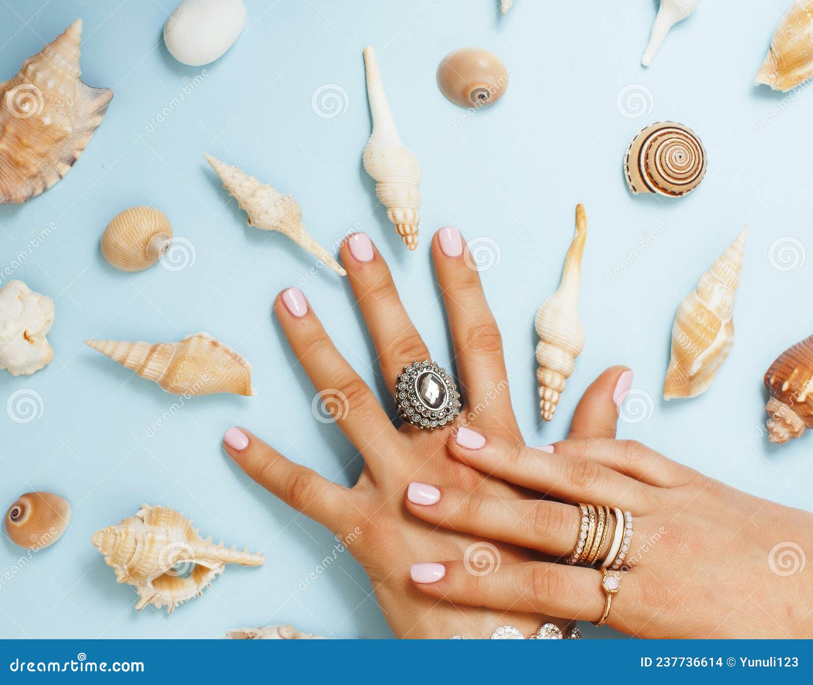 Beautiful Woman Hands With Pink Manicure Holding Plate With Pearls And