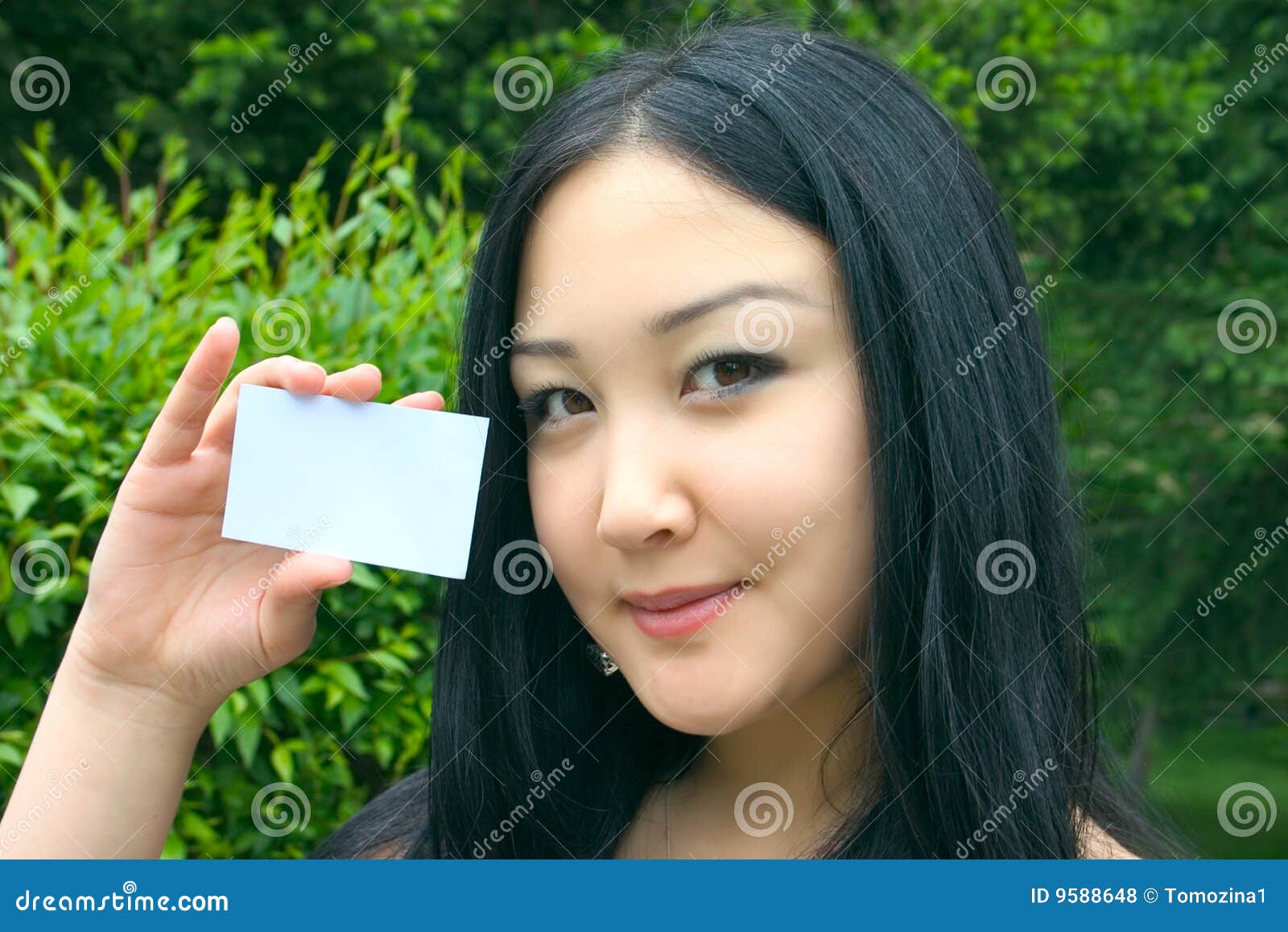 Beautiful Woman Holds Card in Hand Stock Photo - Image of young, beauty ...