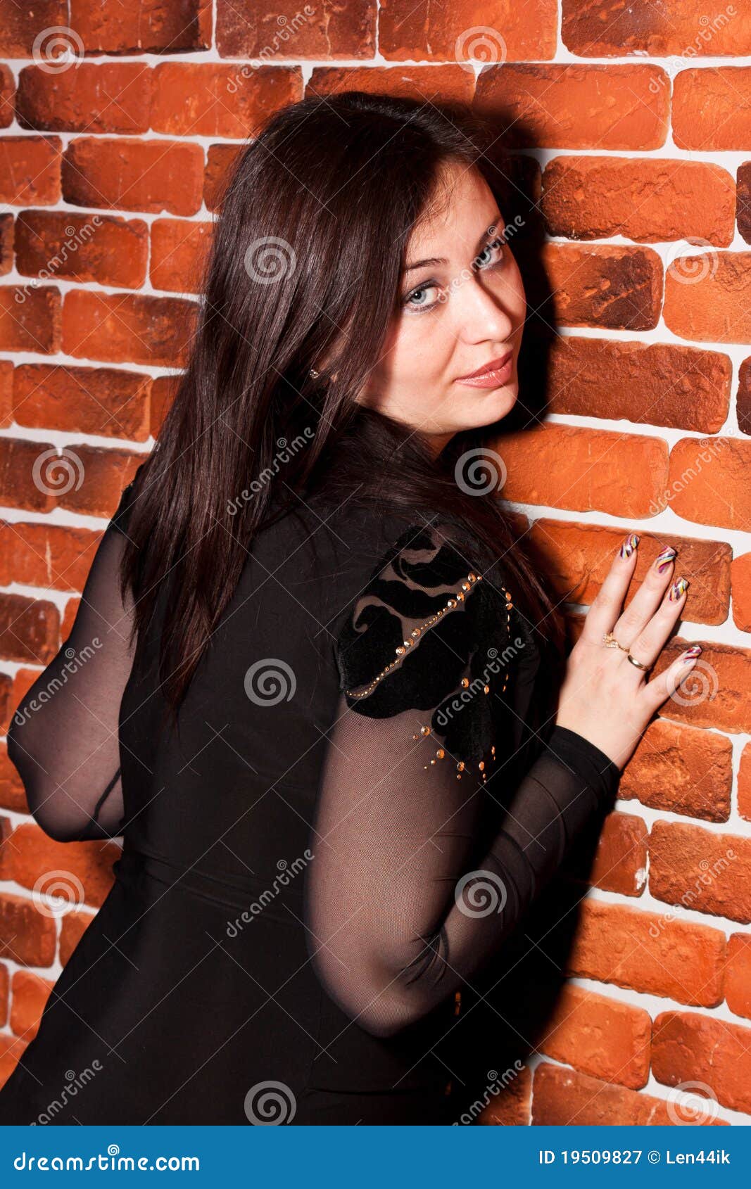 Beautiful Woman Leaning Against Brick Wall Stock Image - Image of face ...