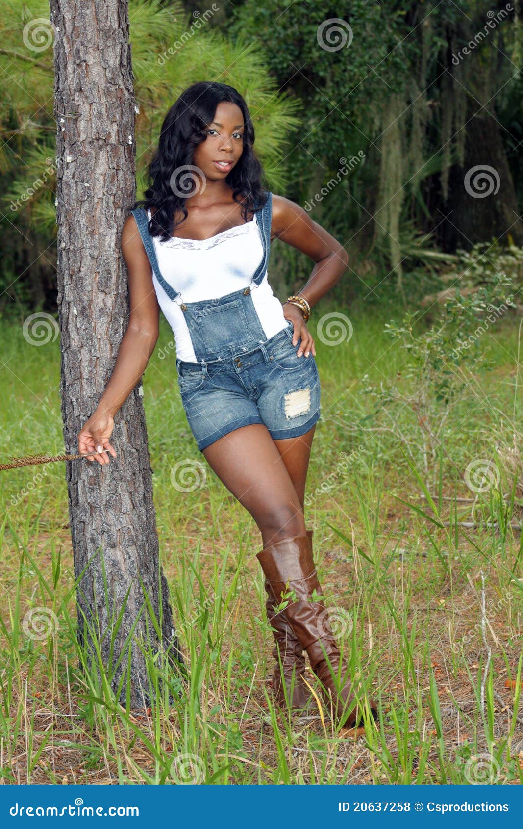 Beautiful Woman Leaning Against a Pine Tree (1) Stock Photo - Image of ...