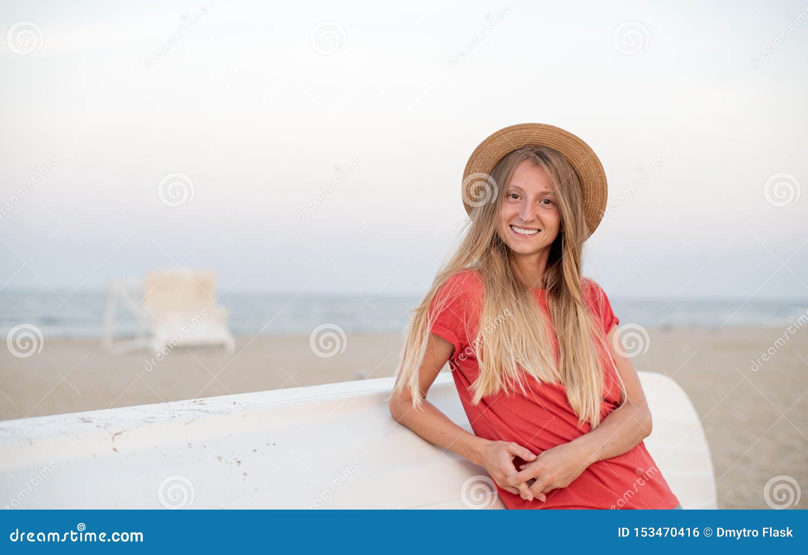 Beautiful Woman With Long Hair Wear Straw Hat On The Beach Near Wooden