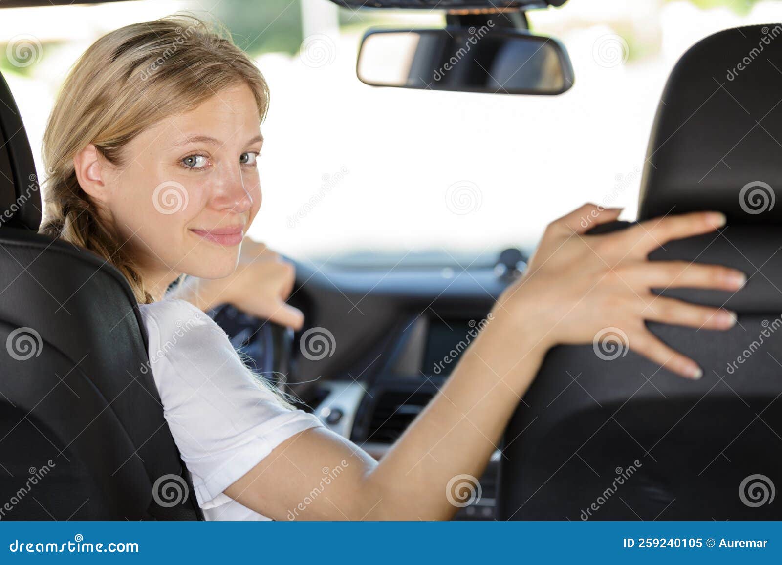 Beautiful Woman Looking Back while Driving Car Stock Image - Image of ...